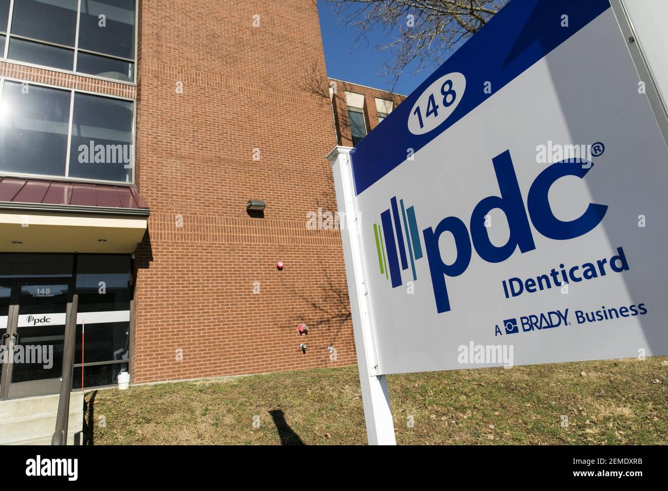 A logo sign outside of the headquarters of PDC IDenticard in Manheim ...
