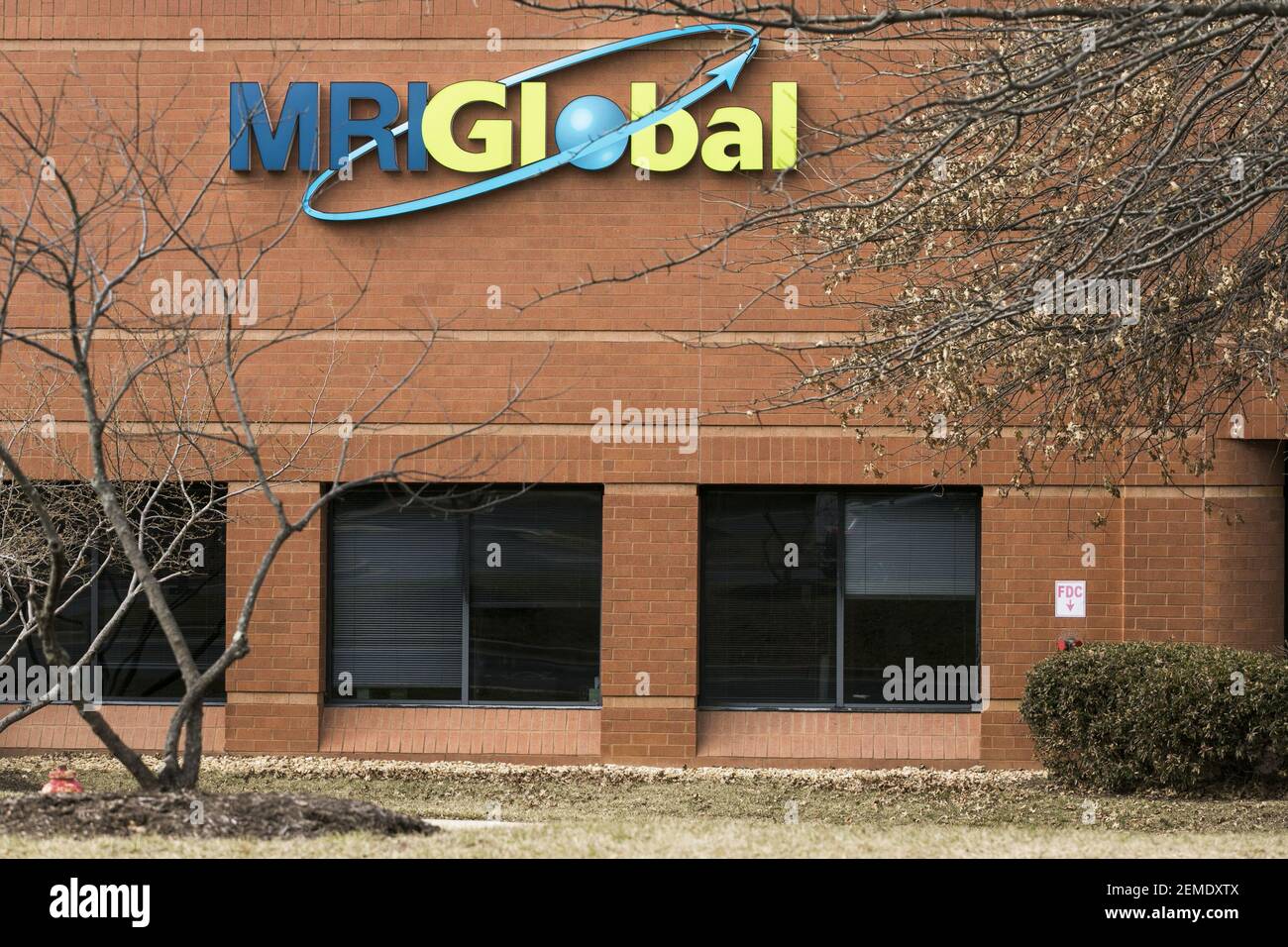 A logo sign outside of a facility occupied by MRIGlobal in Gaithersburg ...