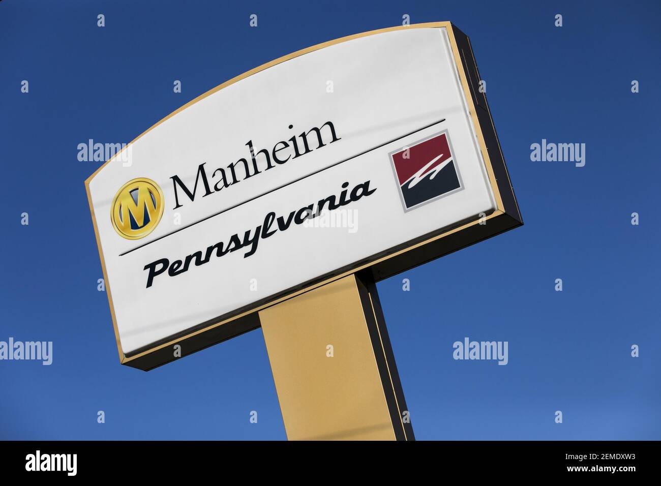 A logo sign outside of a Manheim auto auction site in Manheim ...