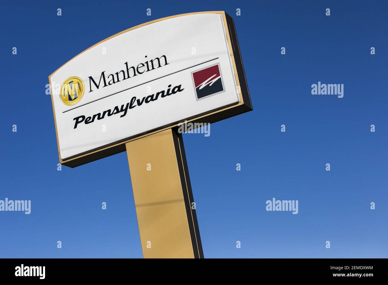 A logo sign outside of a Manheim auto auction site in Manheim ...