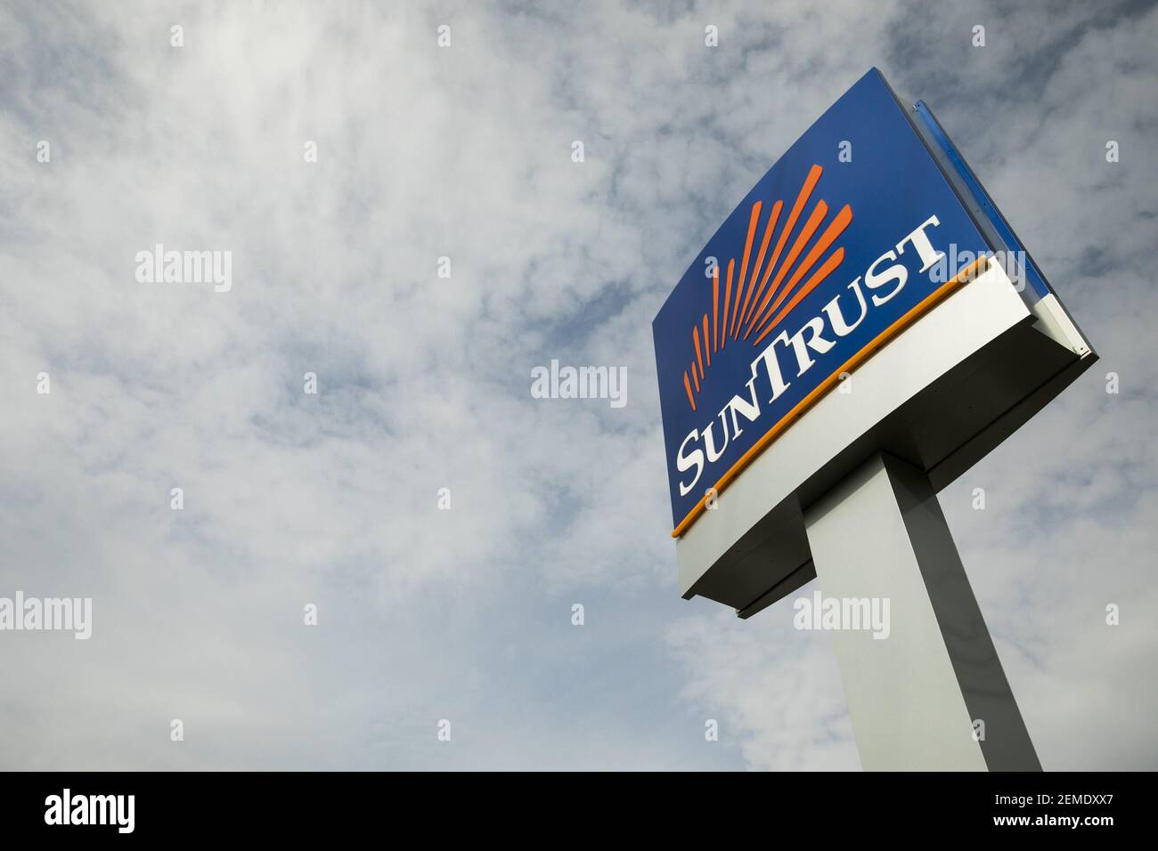 A logo sign outside of a SunTrust Bank branch in Gaithersburg, Maryland ...