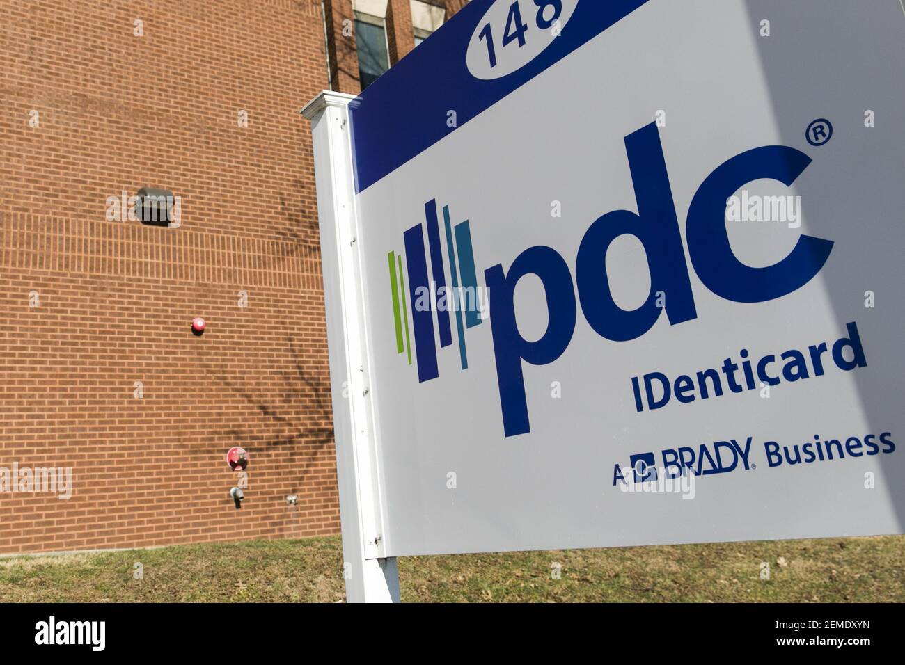 A logo sign outside of the headquarters of PDC IDenticard in Manheim ...