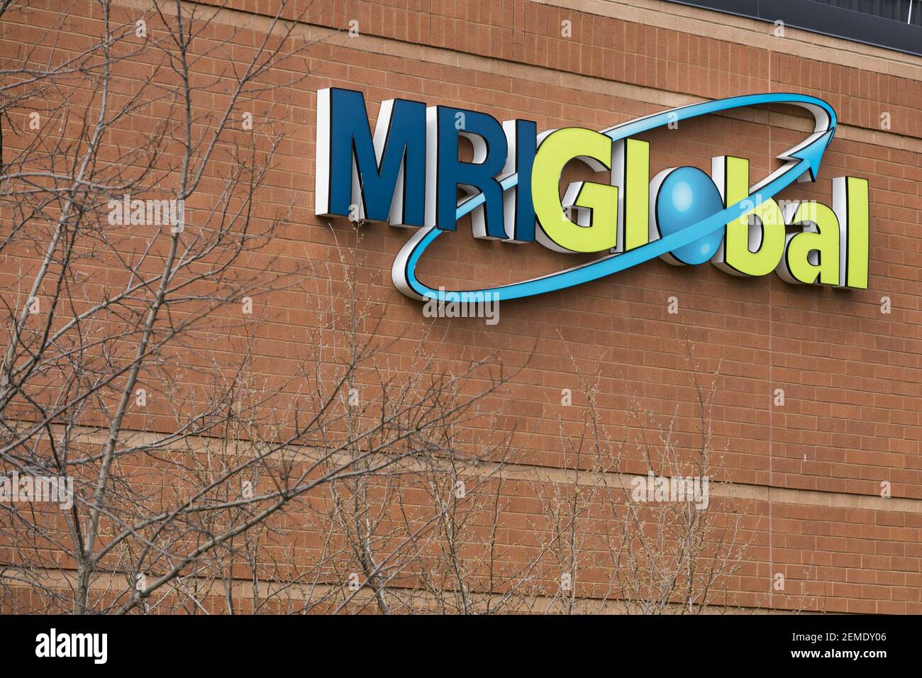 A logo sign outside of a facility occupied by MRIGlobal in Gaithersburg ...