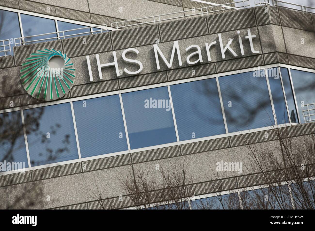 A logo sign outside of a facility occupied by IHS Markit in ...