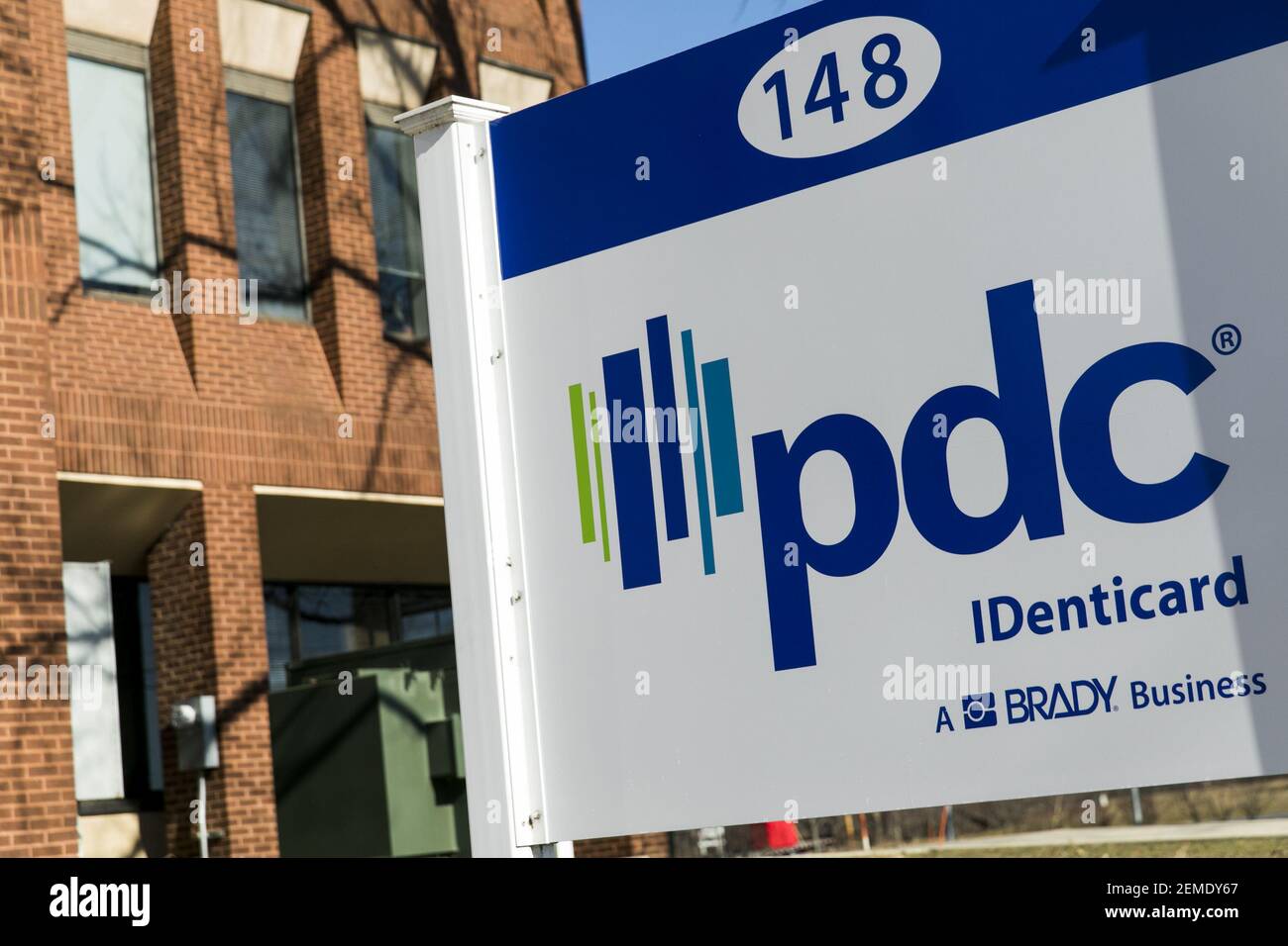 A logo sign outside of the headquarters of PDC IDenticard in Manheim ...