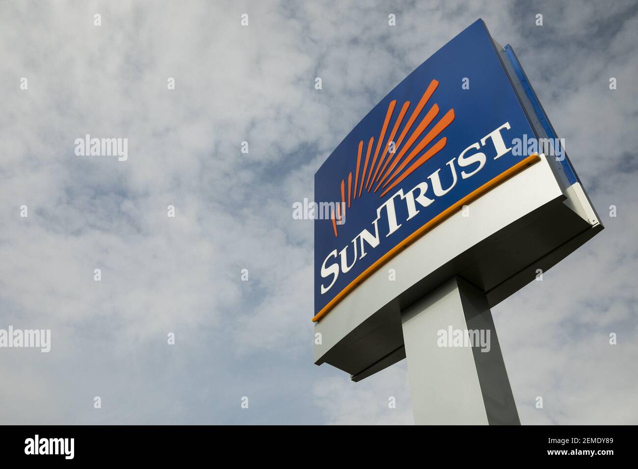 A logo sign outside of a SunTrust Bank branch in Gaithersburg, Maryland ...