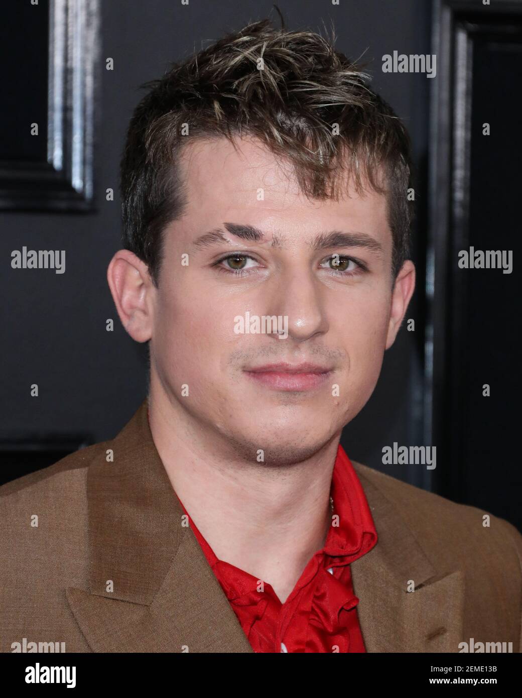 LOS ANGELES, CA, USA - FEBRUARY 10: Singer Charlie Puth wearing a Prada ...