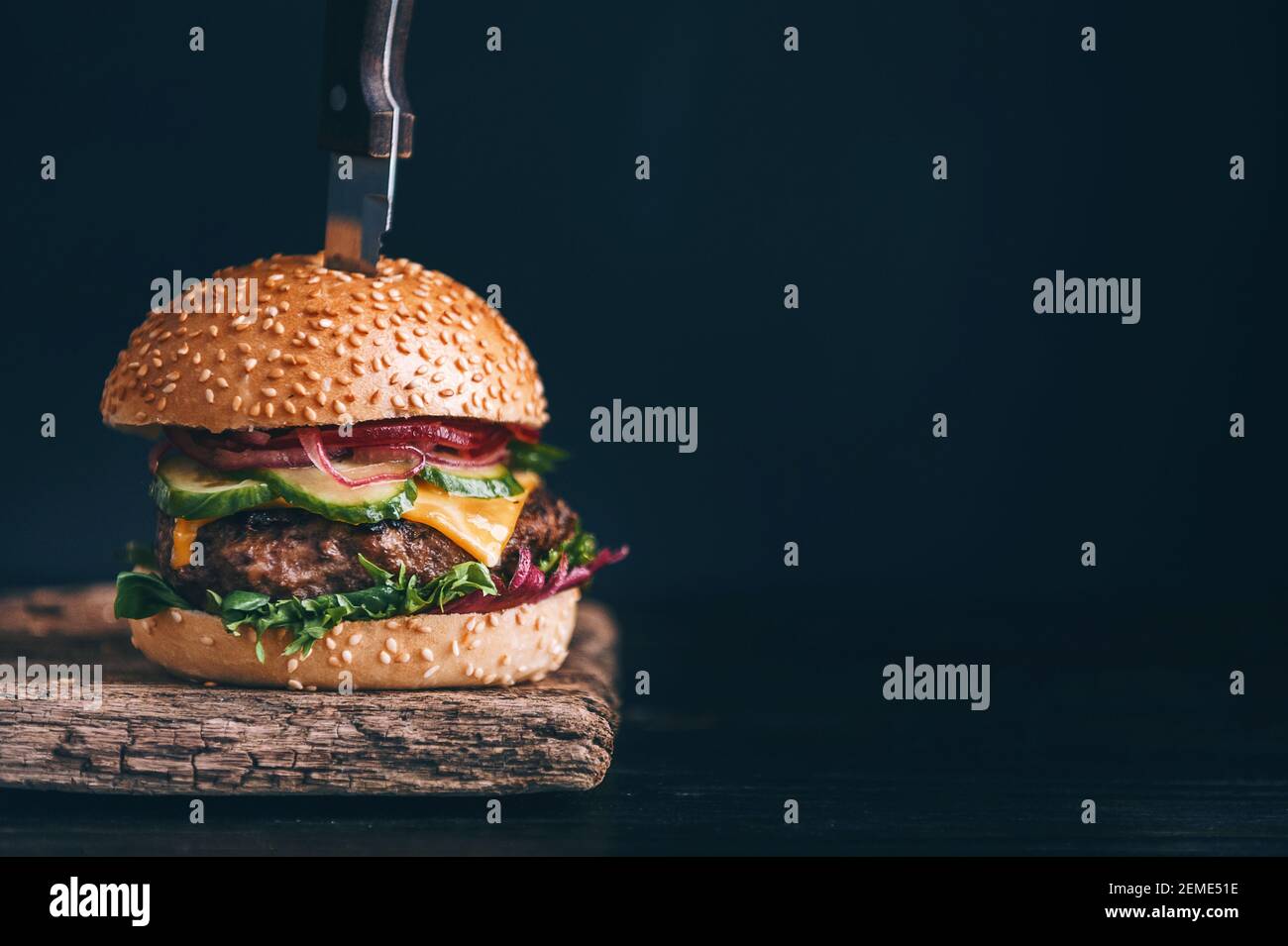 mouth-watering, delicious homemade burger used to chop beef. on the ...