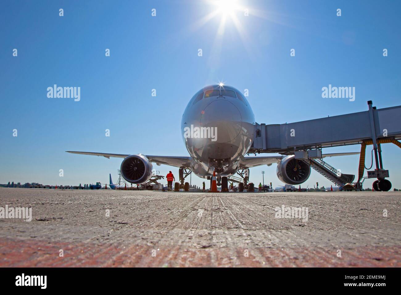 Boarding passengers on the plane through the boarding bridge. The plane ...