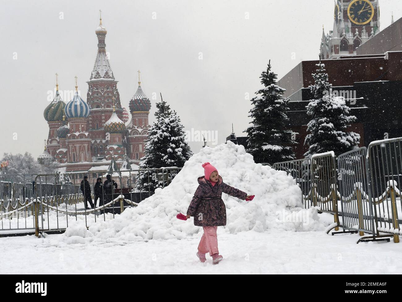 Genre photography. Snowfall in Moscow. The Red Square. Mausoleum and St ...