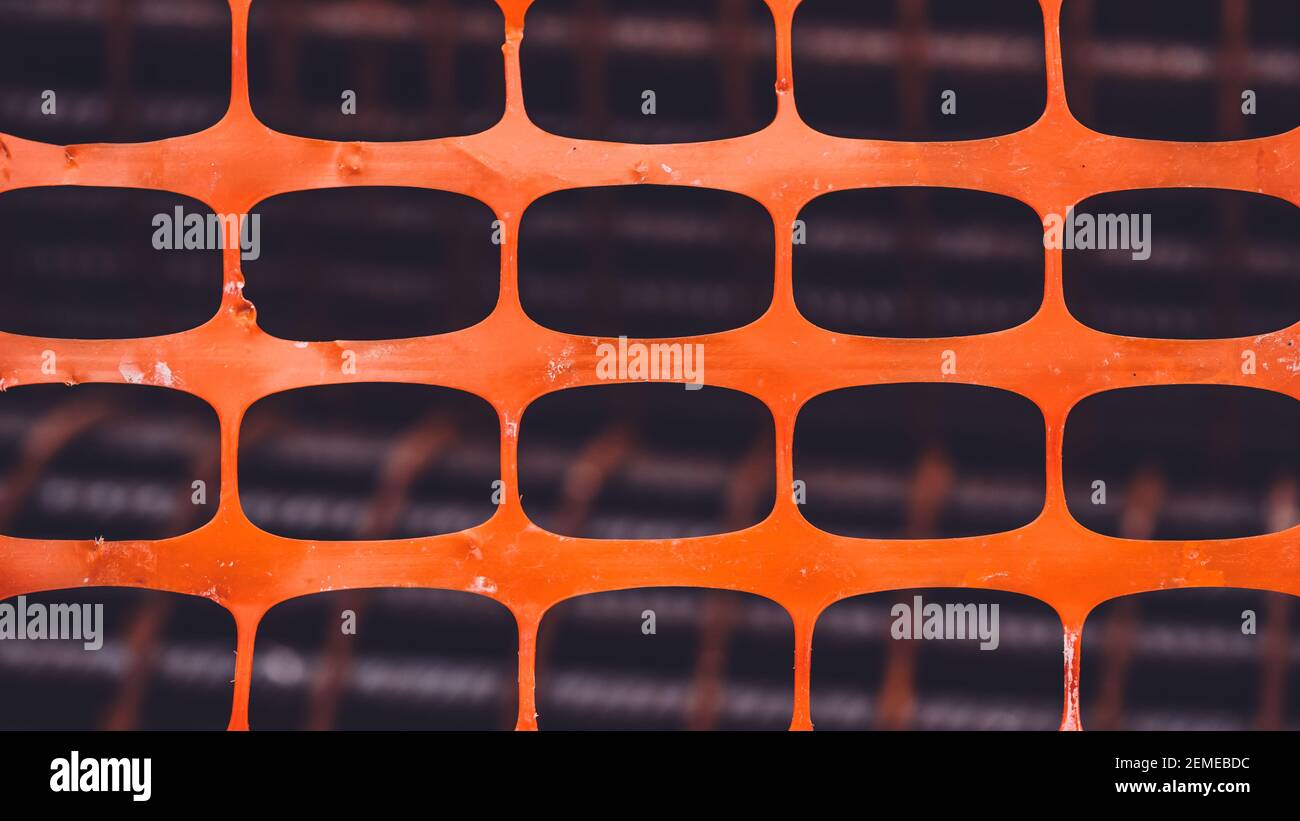 orange plastic net on construction site. Texture background of net ...