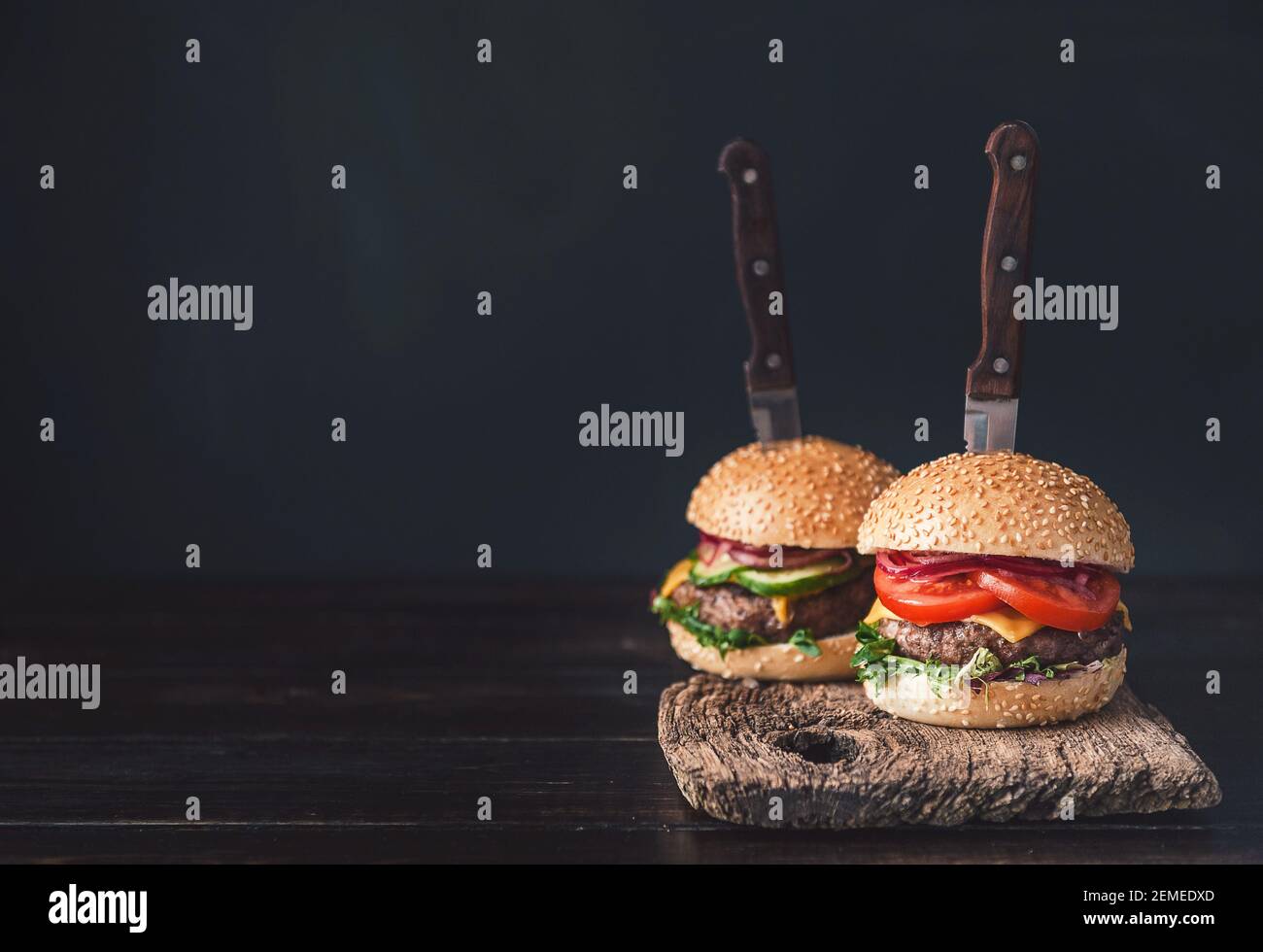 Two mouth-watering, delicious homemade burger used to chop beef. on the ...