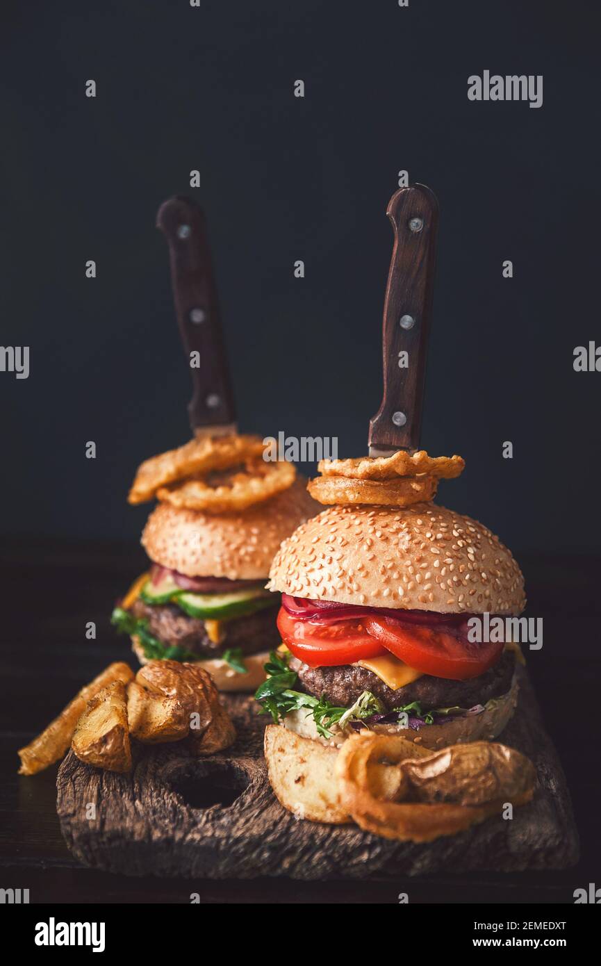 Two mouth-watering, delicious homemade burger used to chop beef. on the ...