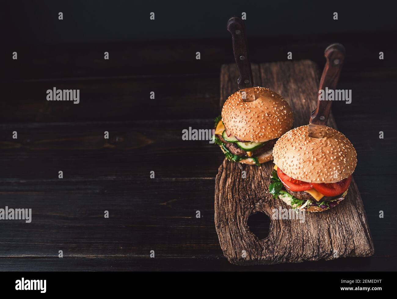 Two mouth-watering, delicious homemade burger used to chop beef. on the ...