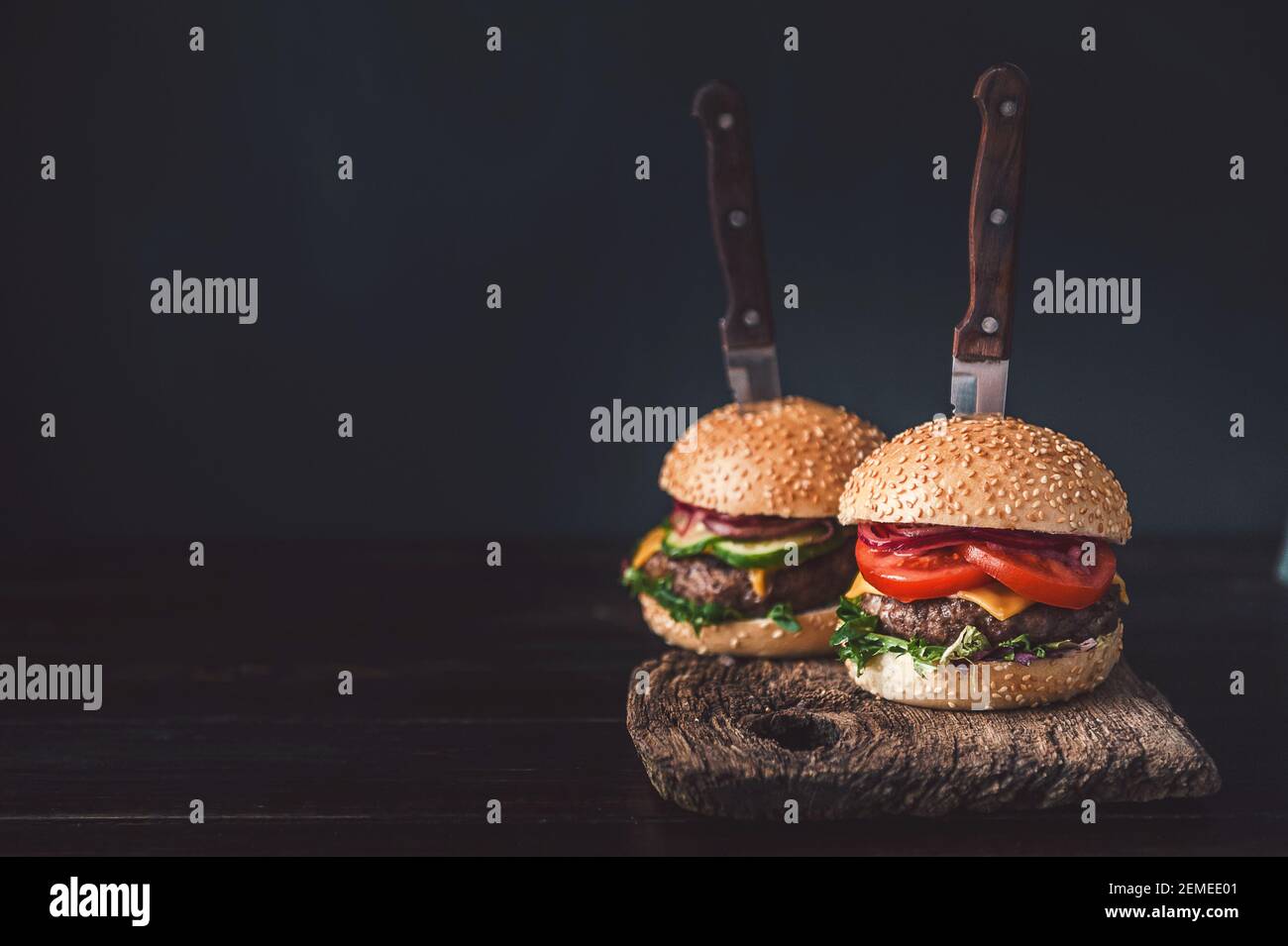 Two mouth-watering, delicious homemade burger used to chop beef. on the ...