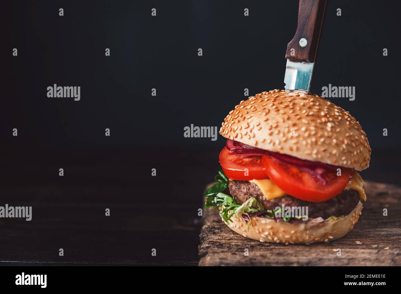 mouth-watering, delicious homemade burger used to chop beef. on the ...