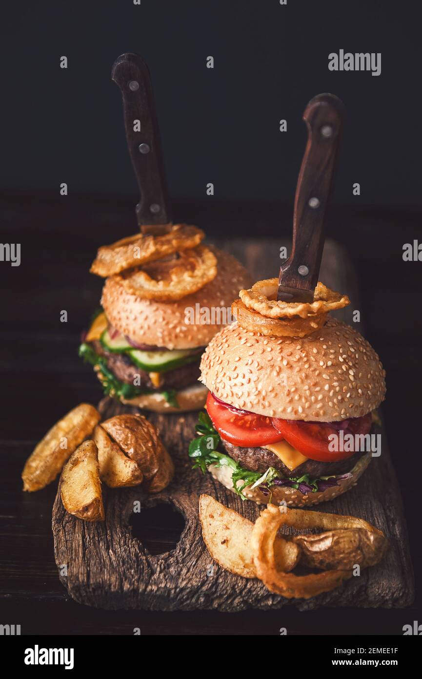 Two mouth-watering, delicious homemade burger used to chop beef. on the ...