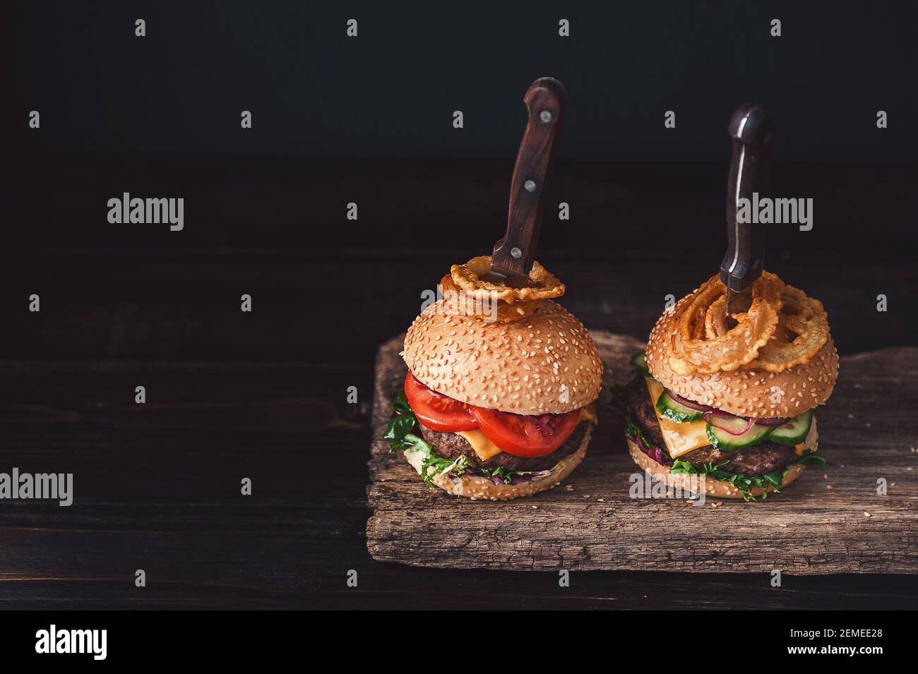 Two mouth-watering, delicious homemade burger used to chop beef. on the ...
