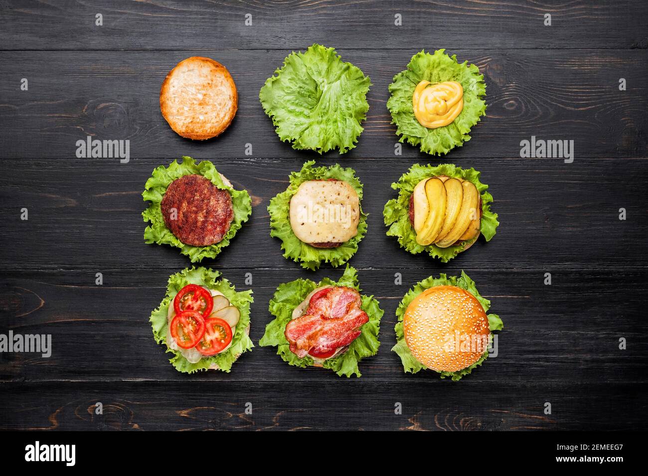 Ingredients for burger. view from above. Black wood background Stock ...