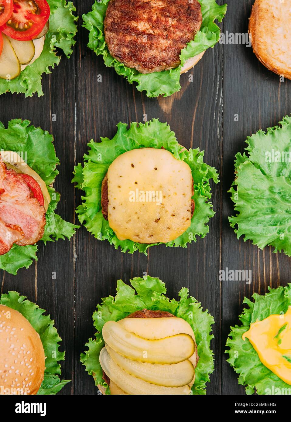 Ingredients for burger. Nine burgers in different stages of readiness ...