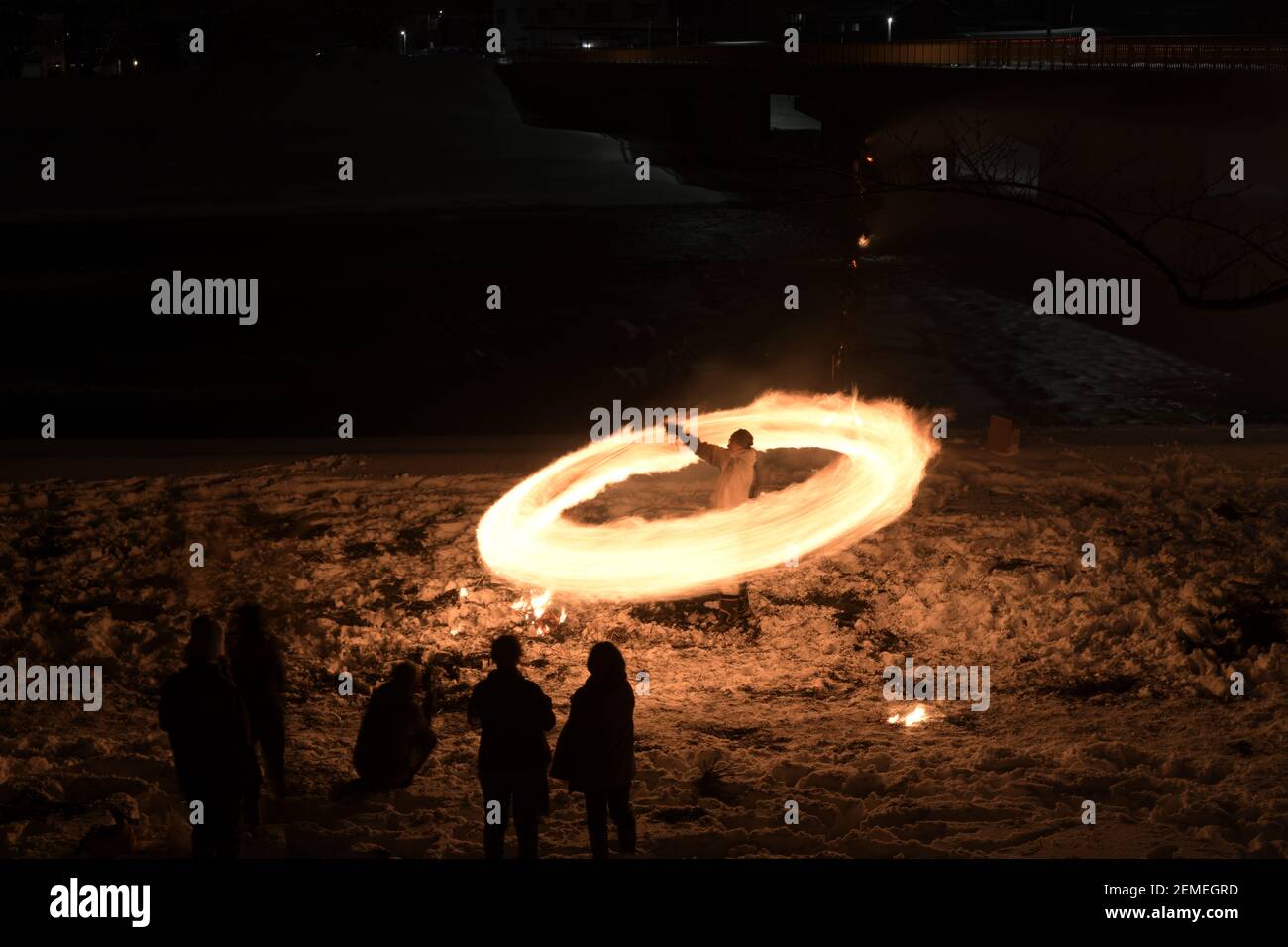 SEMBOKU, AKITA, JAPAN - FEBRUARY 14: Participant creates a fire ring by ...