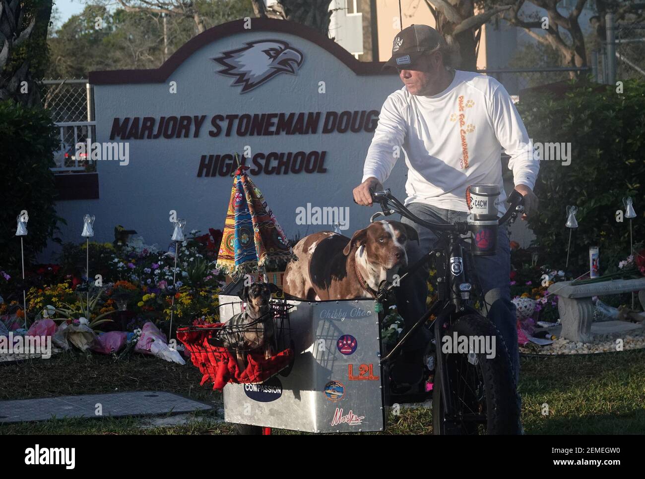 Jay Hamm of Jupiter arrives with his therapy dogs at the memorial ...