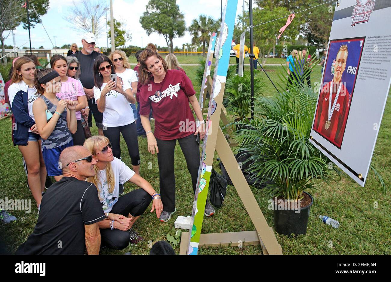 Sitting on the ground, parents of slain Marjory Stoneman Douglas High ...