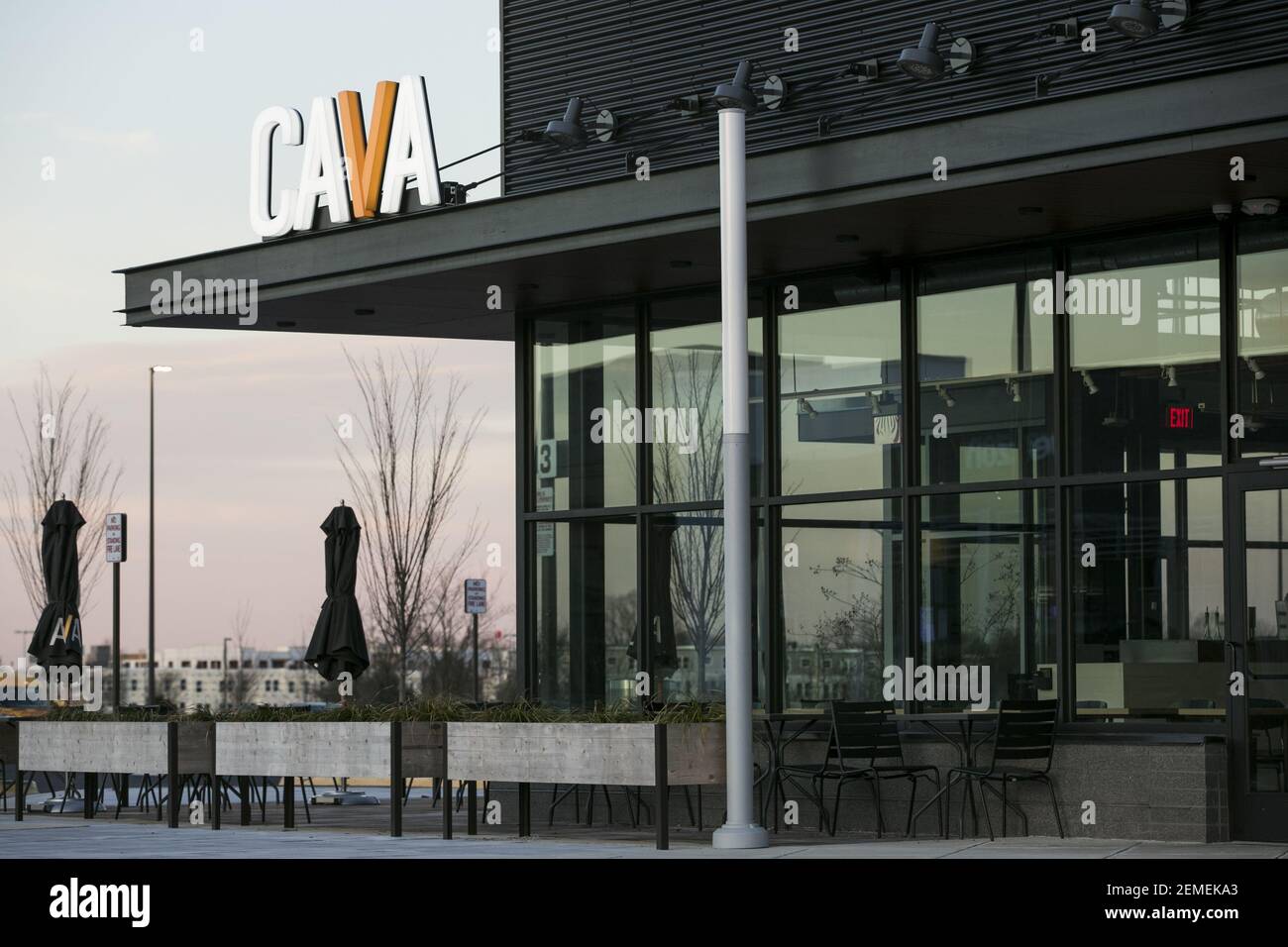 A logo sign outside of a Cava restaurant location in Chantilly ...