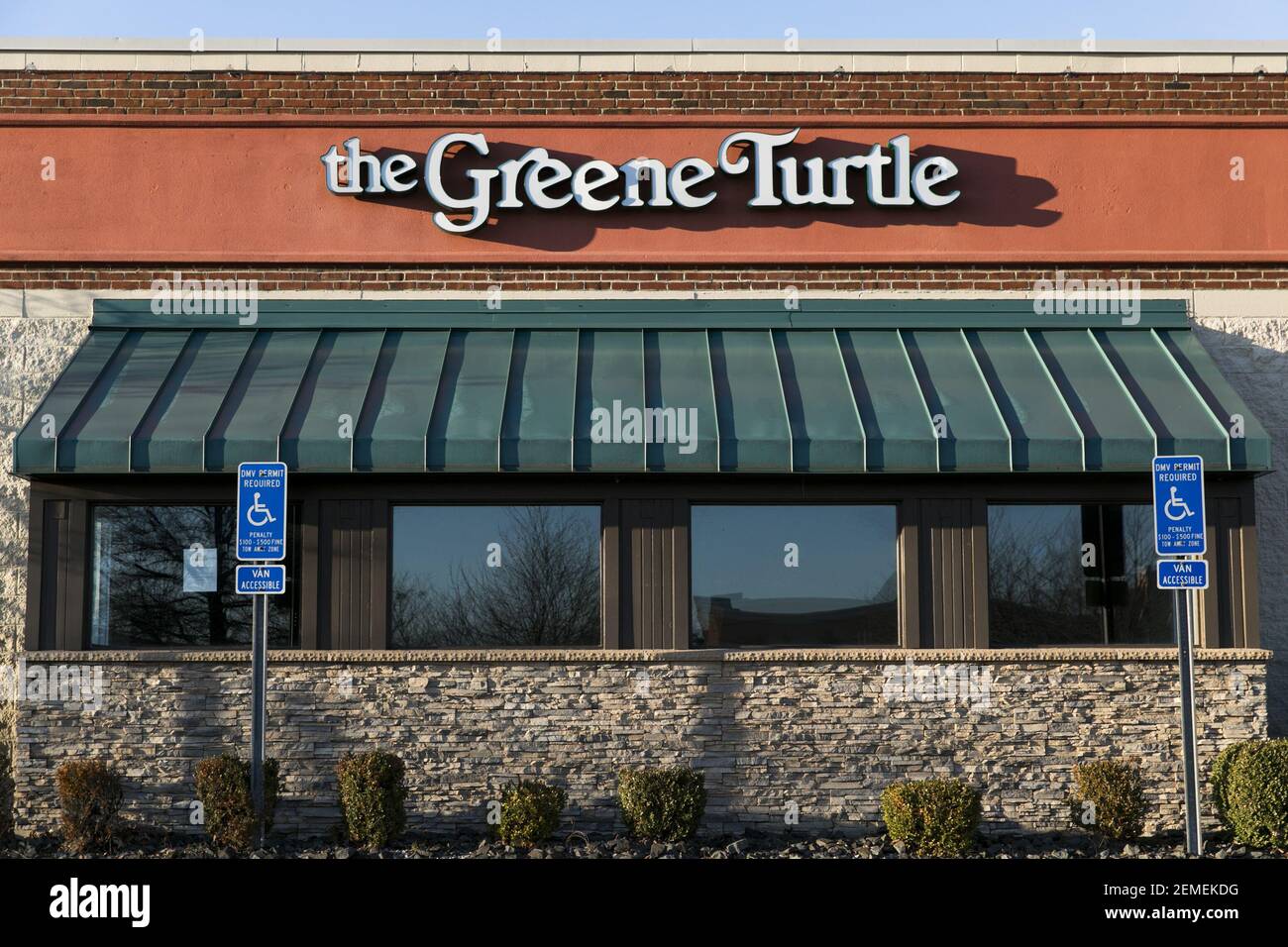 A logo sign outside of a The Green Turtle restaurant location in Dulles ...
