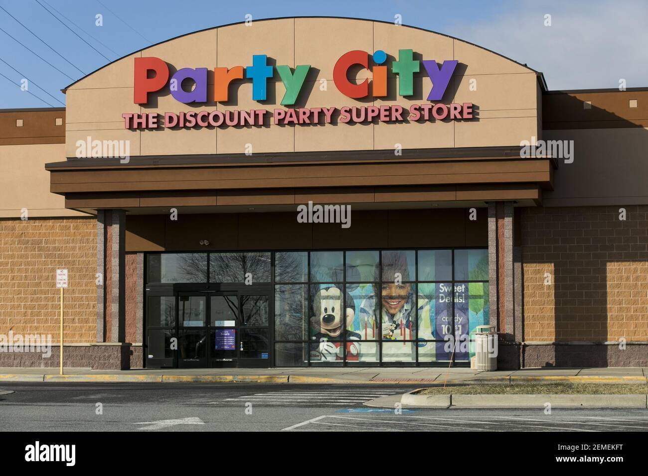 A logo sign outside of a Party City retail store location in Winchester ...
