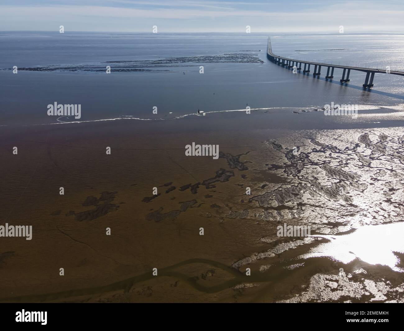 Aerial view of a Vasco da Gama long suspended highway crossing Tagus ...