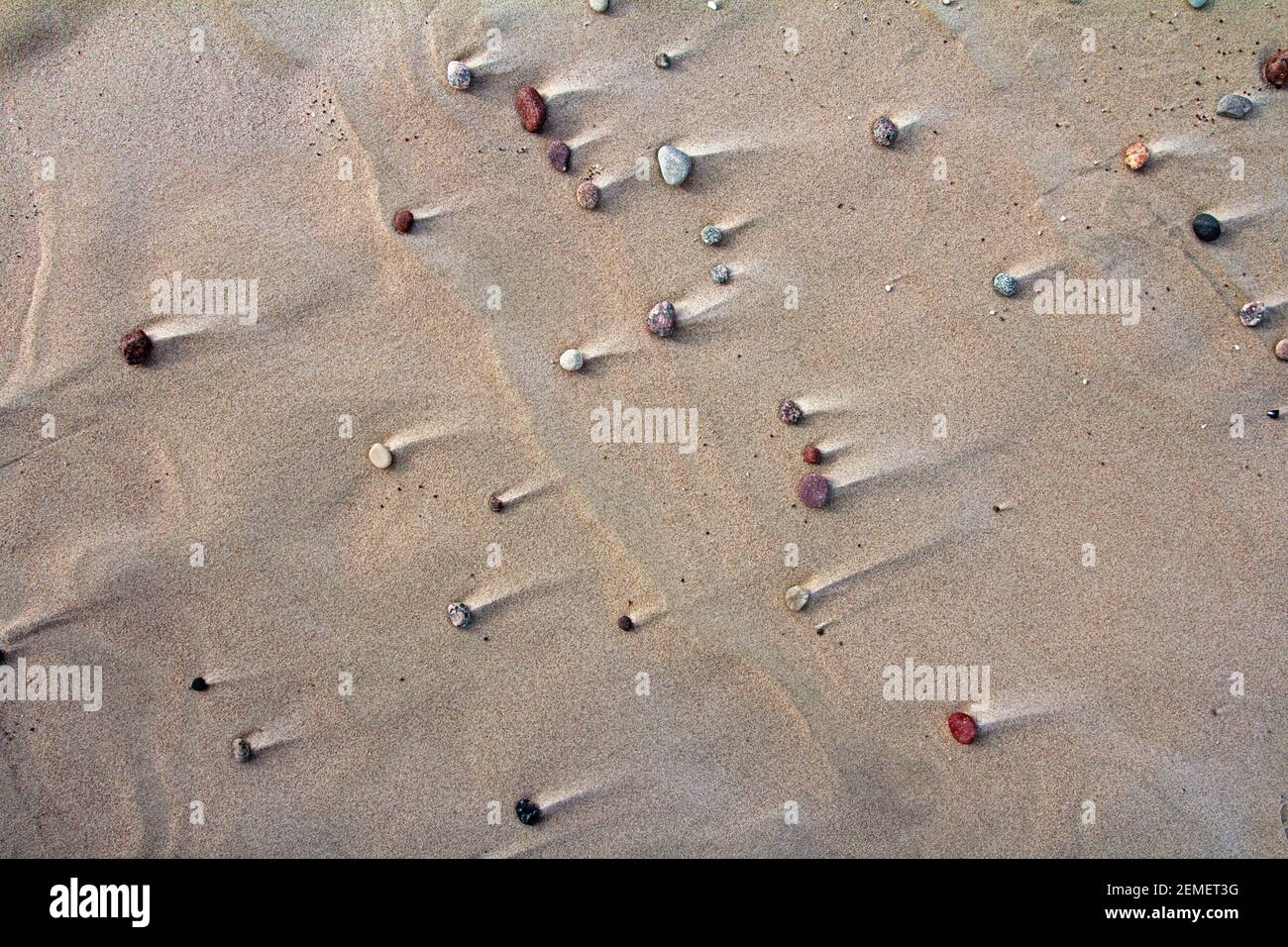 Beautiful colorful pebbles, stones in beach sand. Color photo for ...