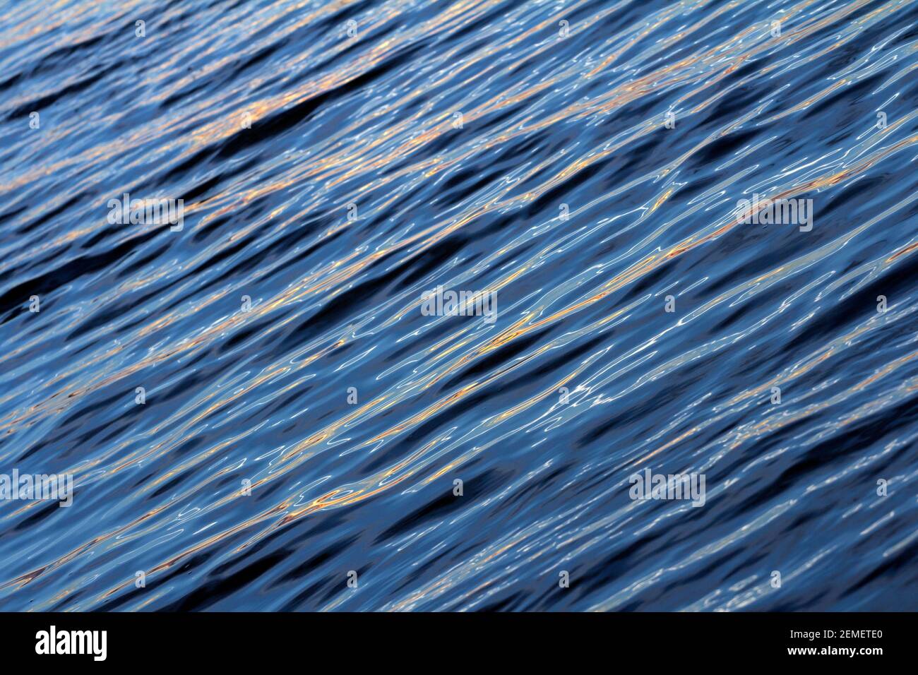 Rippling water surface with sunlight reflection. Color photo ...