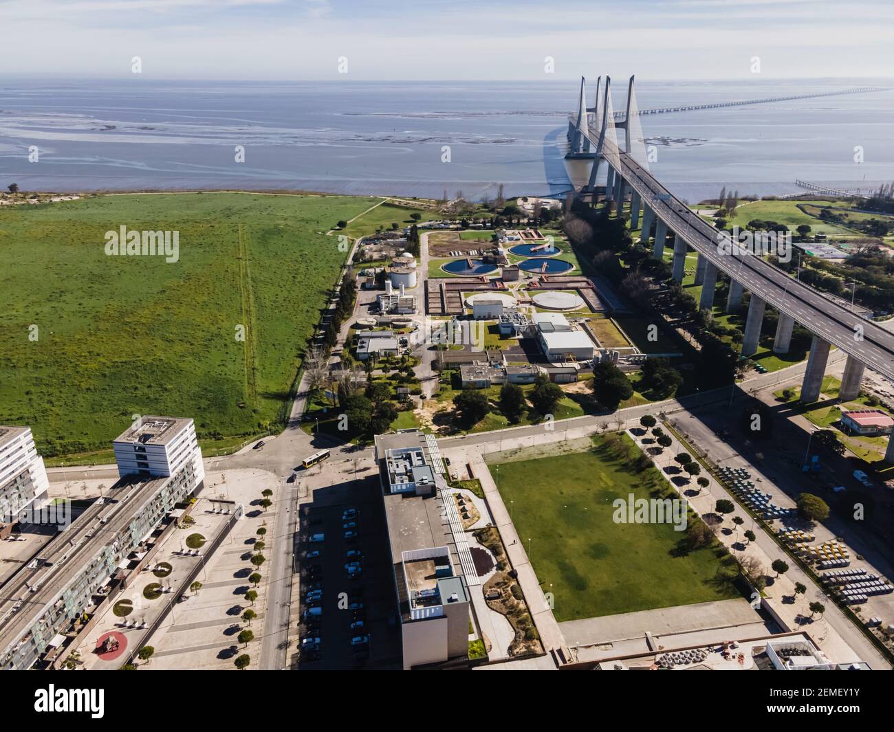 Aerial view of Vasco da Gama bridge crossing Tagus river and an ...