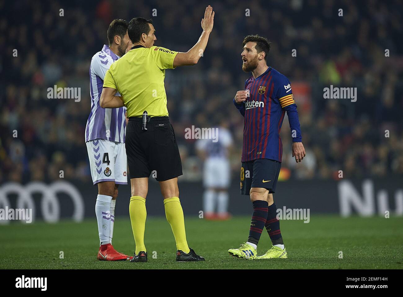 Lionel Messi of FC Barcelona protest after receiving yellow card during ...