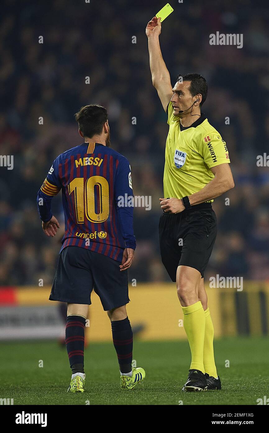 Lionel Messi of FC Barcelona receives yellow card during the match ...