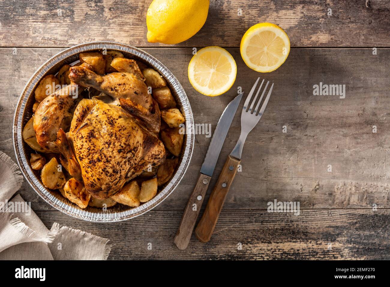 Homemade roasted chicken on wooden table Stock Photo - Alamy