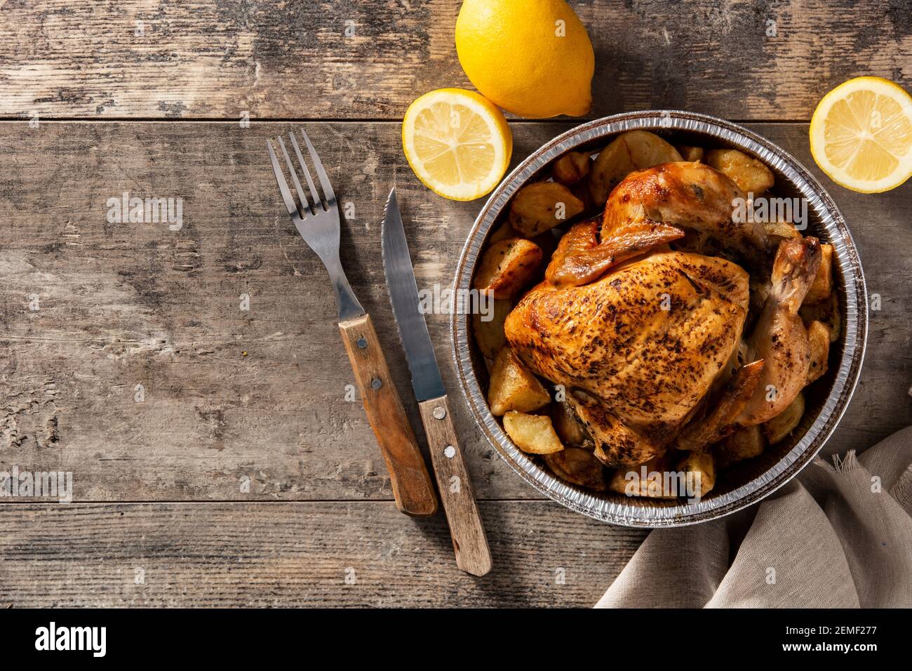 Homemade roasted chicken on wooden table Stock Photo - Alamy
