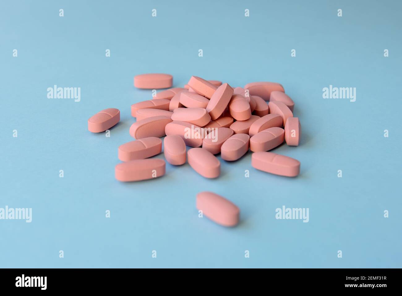 Pills over blue background. Copy space for text Stock Photo - Alamy