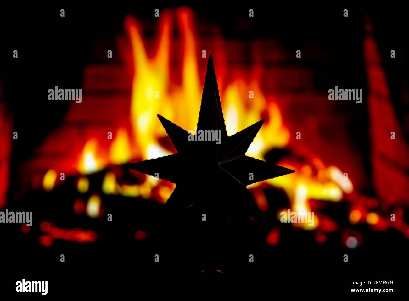 Star silhouette in front of the blazing fireplace Stock Photo - Alamy