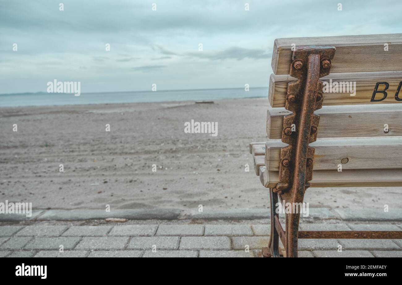 sea view, beach, wood bench, metal side exposed corrosion and ...