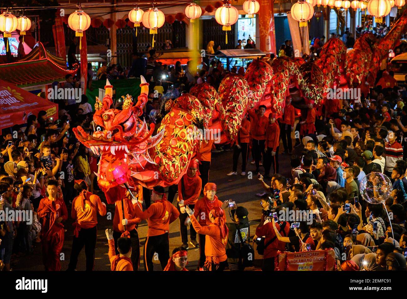 Participants seen performing with a replica of a dragon during the Cap ...