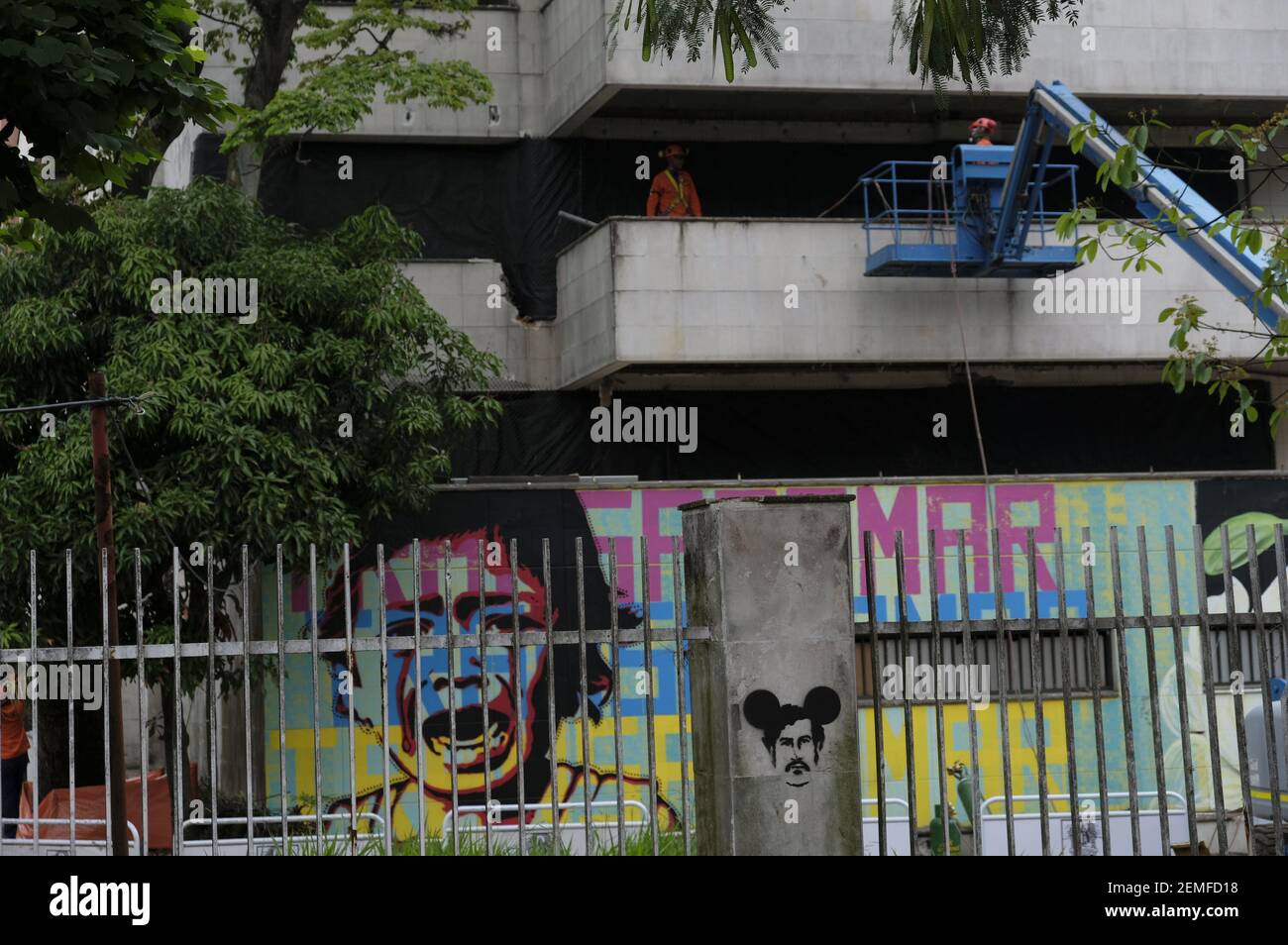 Two workers from the company in charge of the demolition are seen at ...