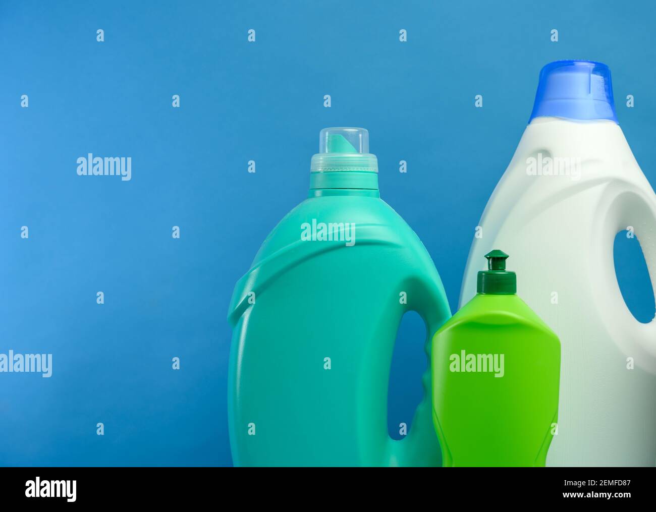 plastic bottles with detergents on blue background, copy space Stock ...