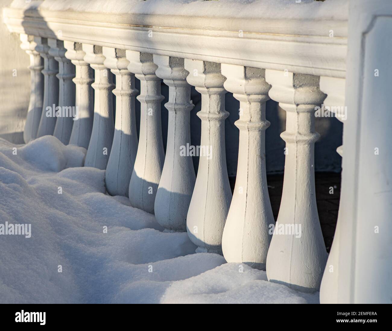 Close-up of white classic balustrade with snow Stock Photo - Alamy