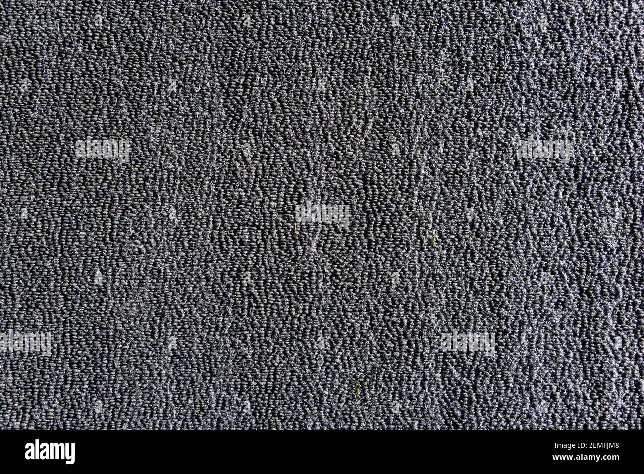 Wall made of small gray decorative stones. Stone background Stock Photo ...