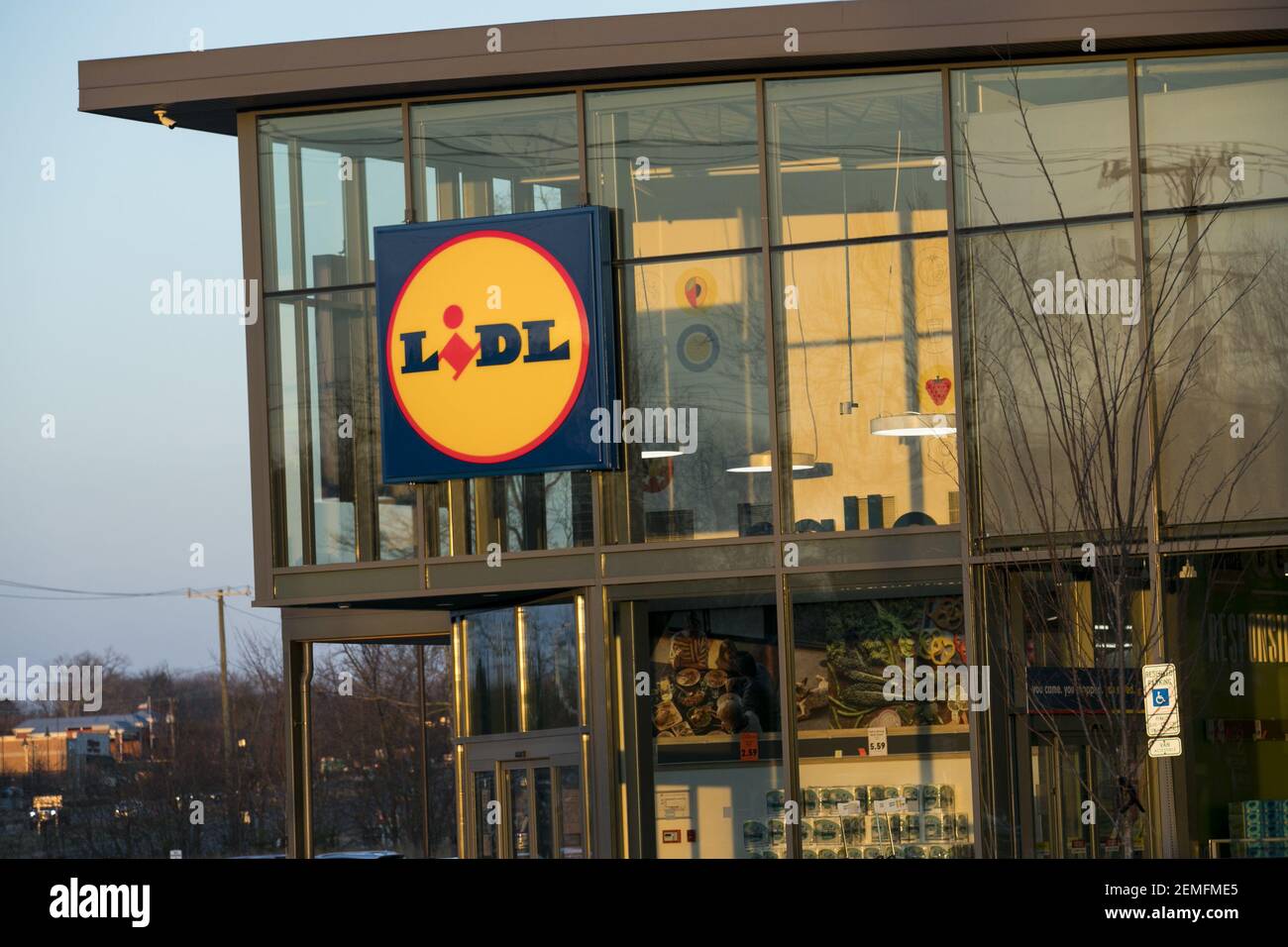 A logo sign outside of a Lidl discount grocery store in Fredericksburg ...