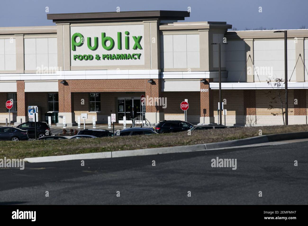 A logo sign outside of a Publix grocery store location in ...