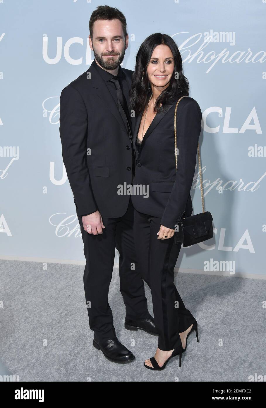 (L-R) Johnny McDaid and Courteney Cox arrives at the UCLA IoES 2019 ...