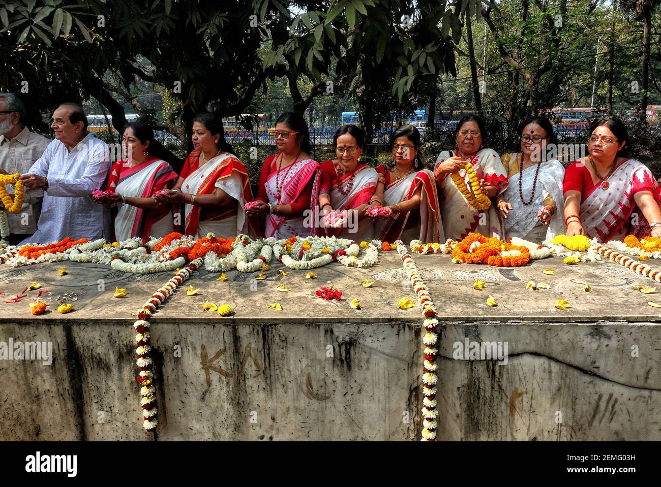 Indian Men and Women are seen paying a Floral Tribute at the Martyr ...